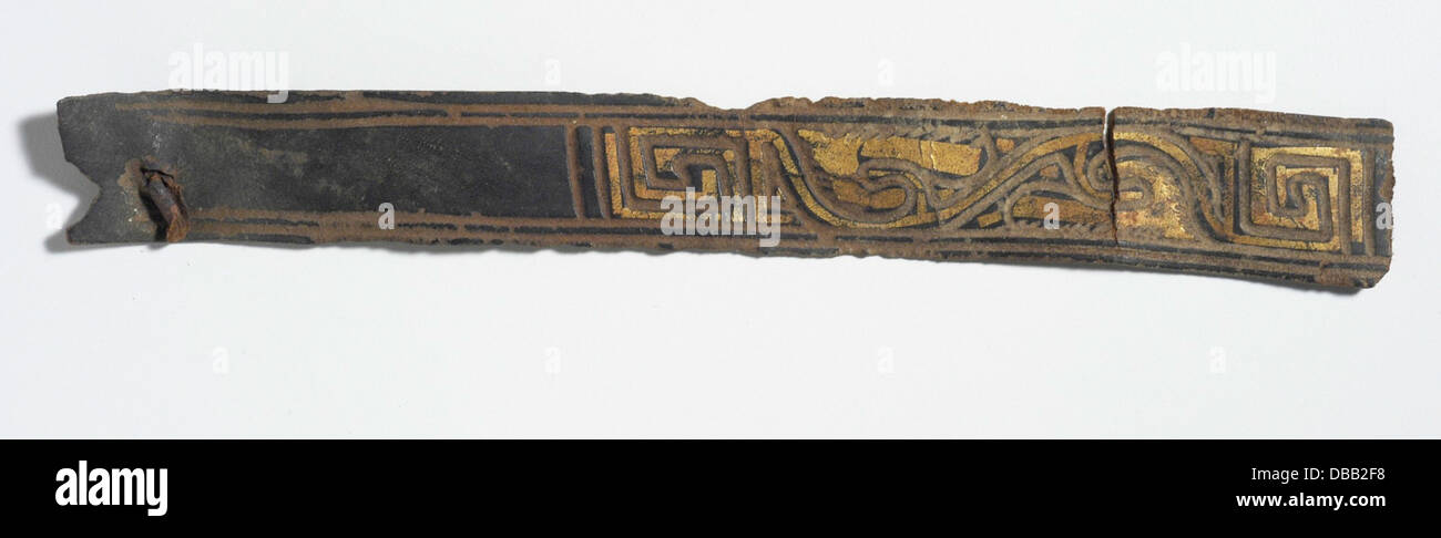 A strip of leather featuring a gold meander design, representing ...