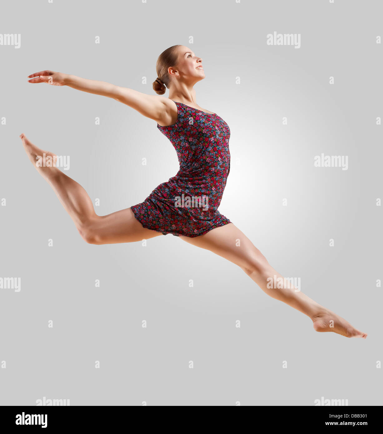 Girl in color dress dancing Stock Photo - Alamy