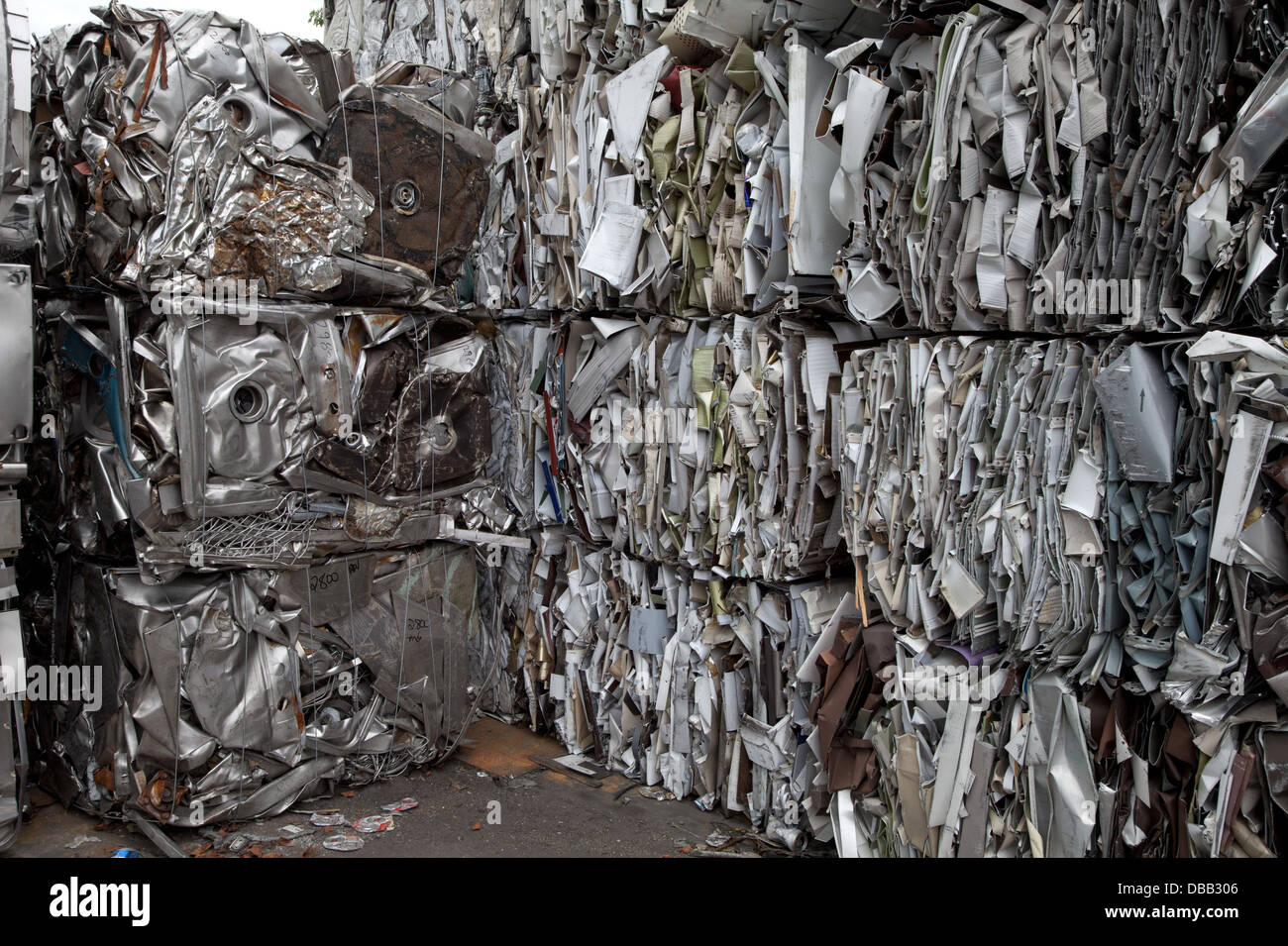 Piles of scrap metal bundled in cubes for recycling Stock Photo - Alamy