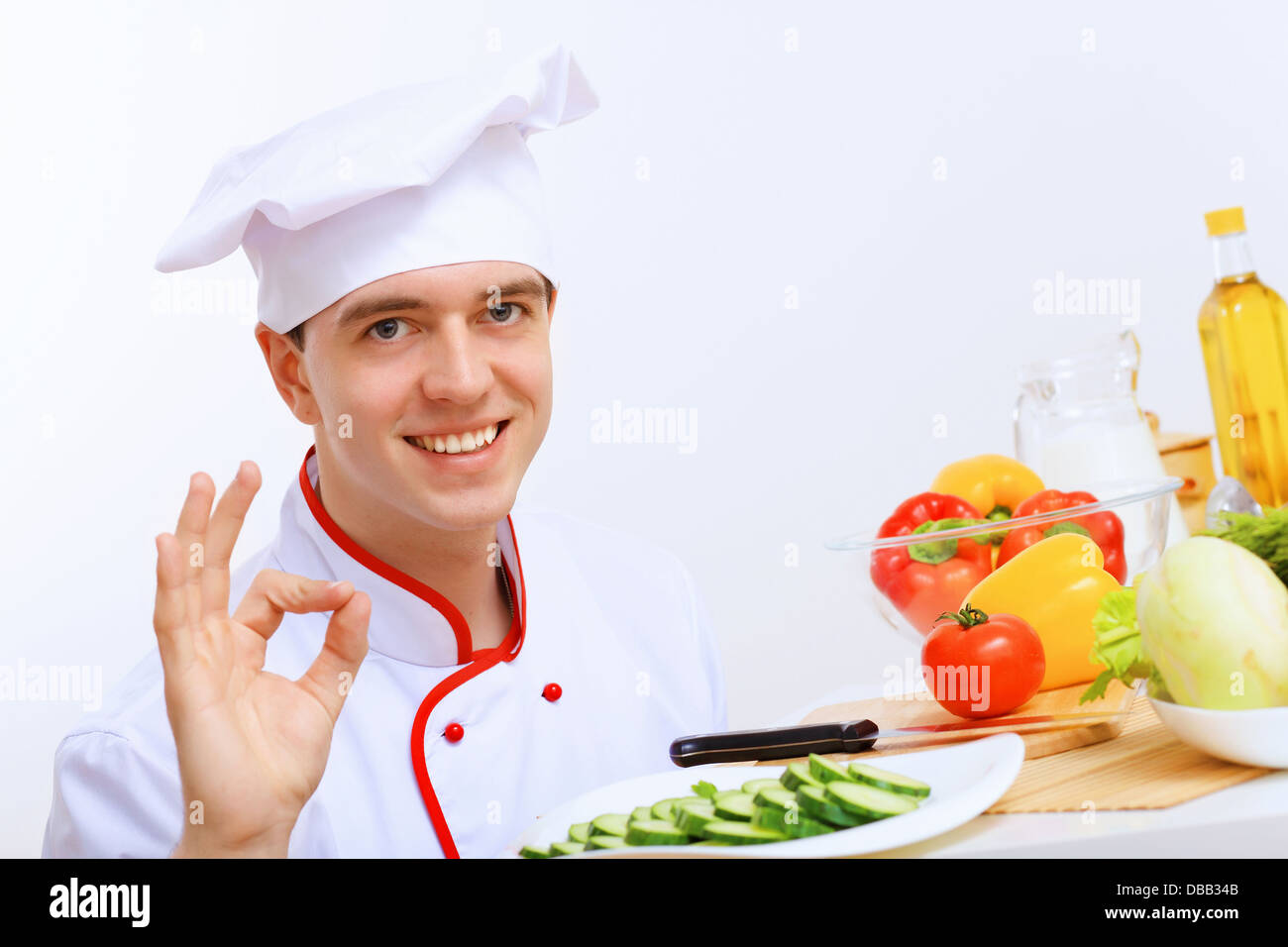 Young cook preparing food Stock Photo - Alamy