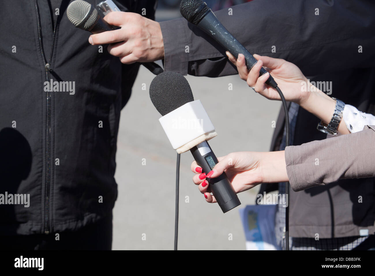 Journalist making interview microphone hi-res stock photography and ...