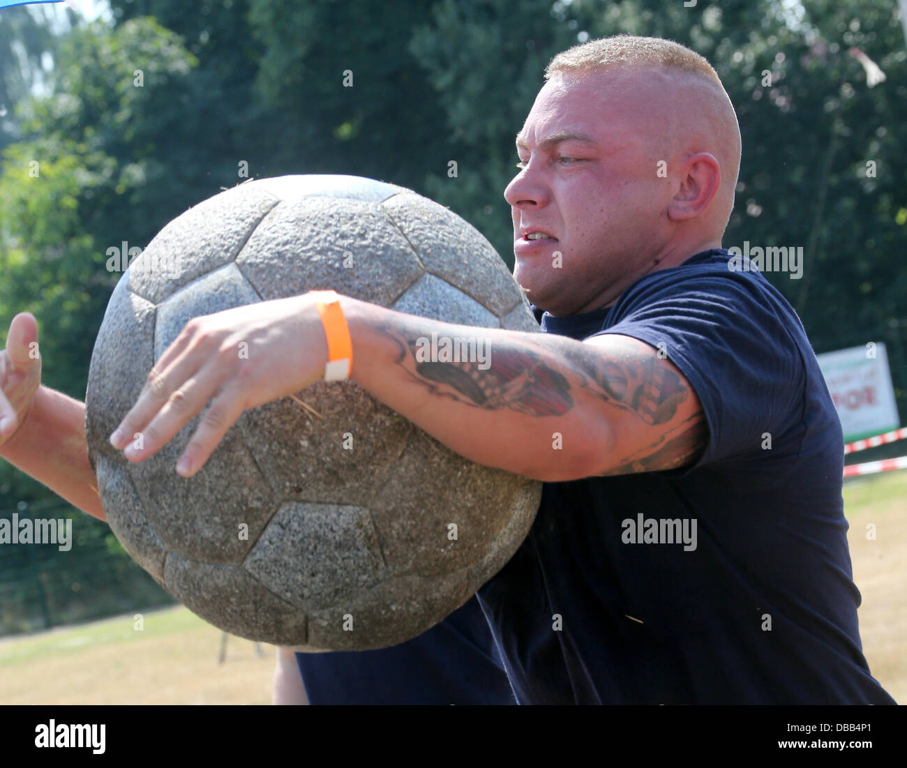 Man lifts stone hi-res stock photography and images - Alamy