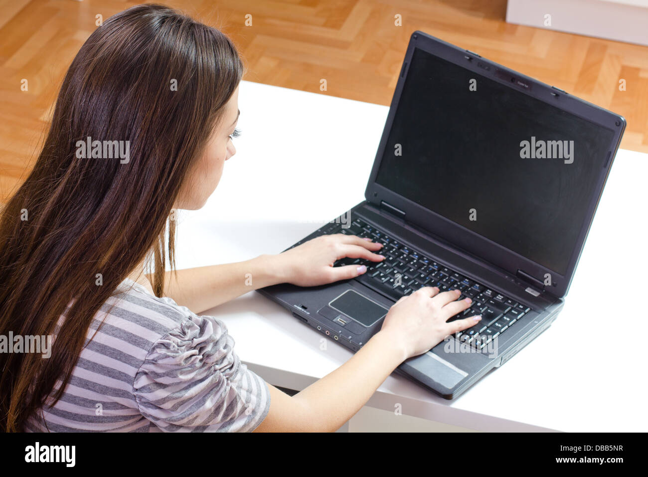 Student girl using computer at home Stock Photo - Alamy