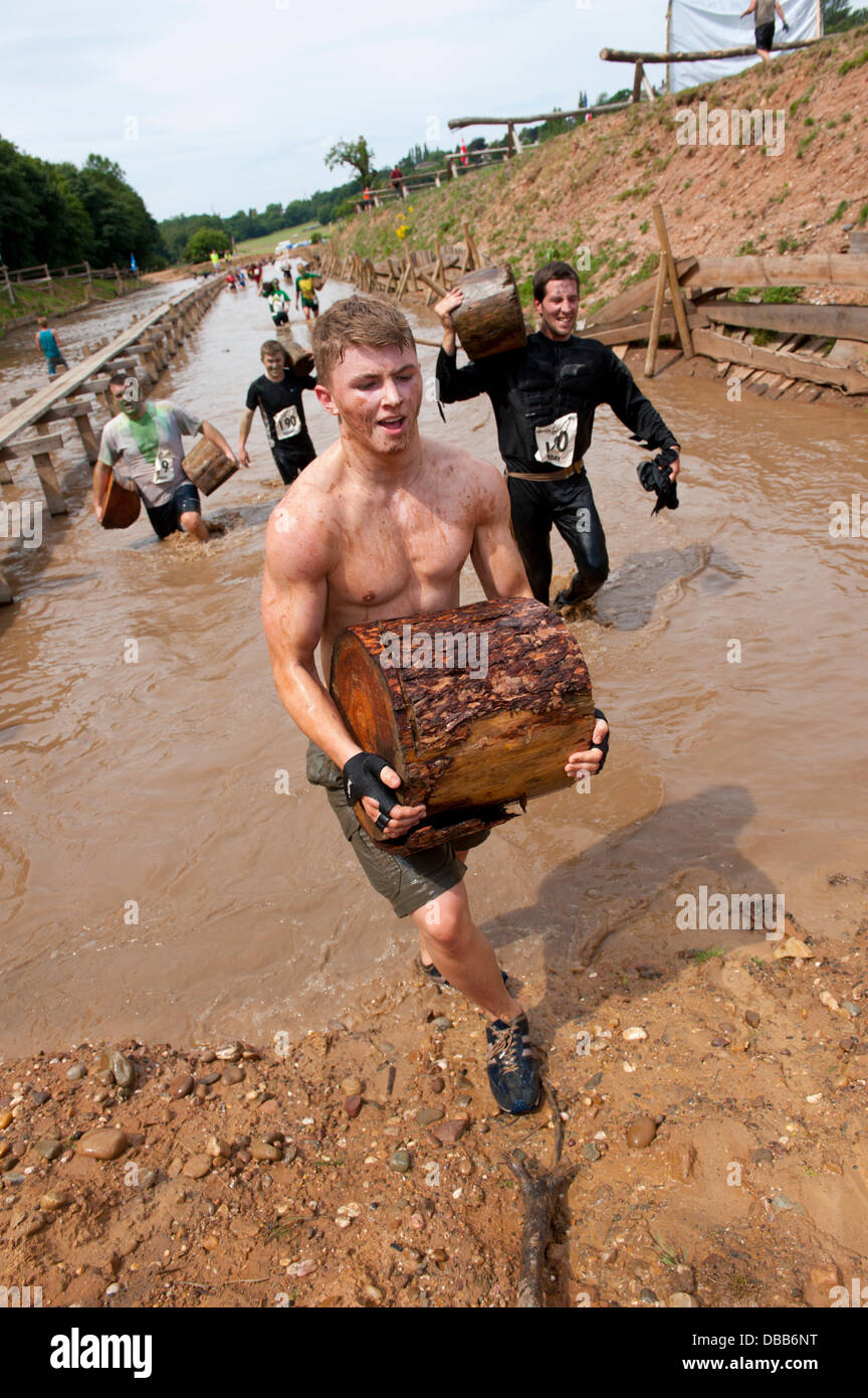 Perton, UK. 27th July 2013. Log Carry in The Zulu Swamp area. 10 km ...