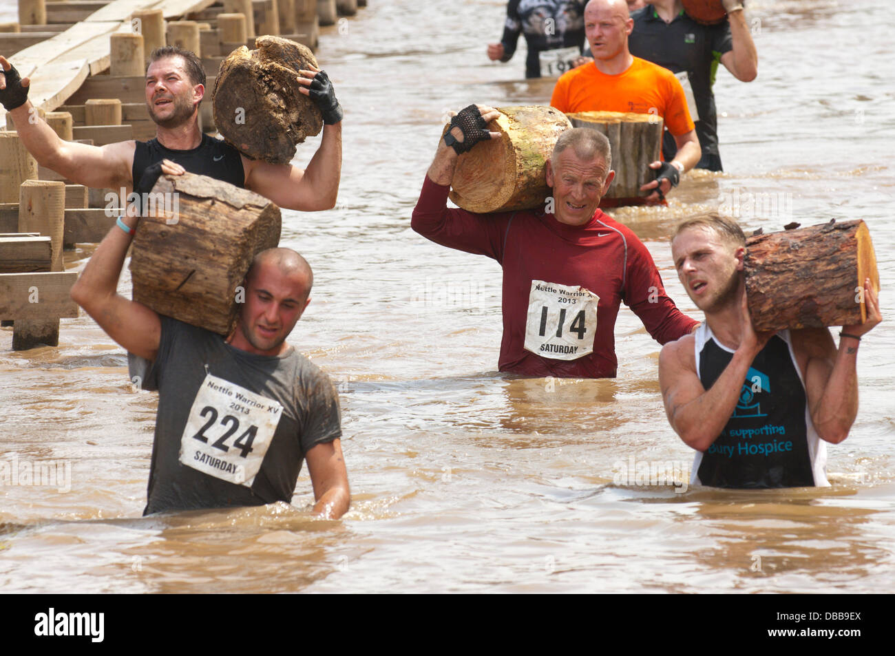 Perton, UK. 27th July 2013. Log Carry in The Zulu Swamp area. The ...