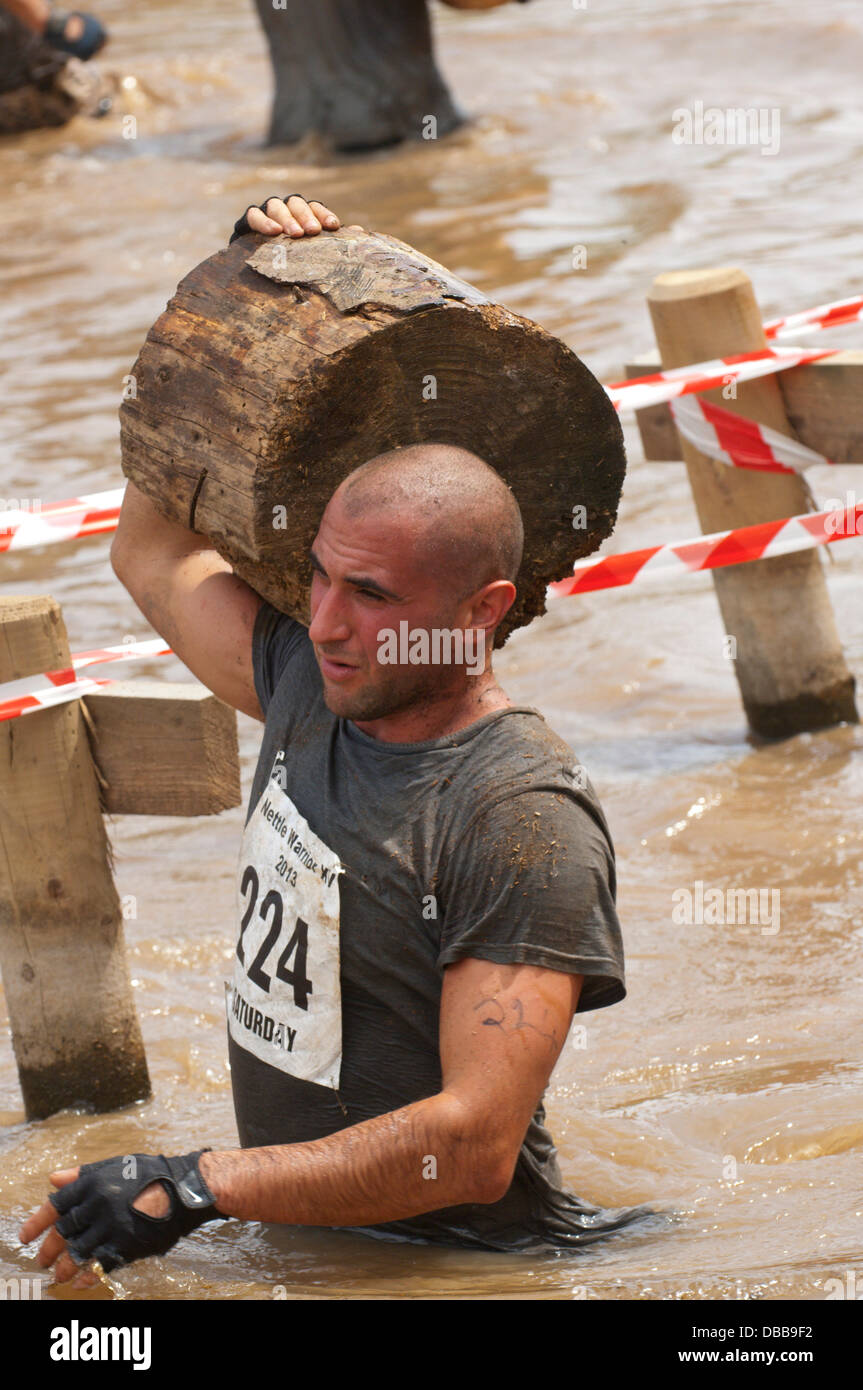 Perton, UK. 27th July 2013. Log Carry in The Zulu Swamp area. The ...