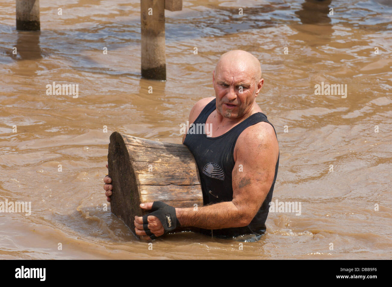 Perton, UK. 27th July 2013. Log Carry in The Zulu Swamp area. The ...