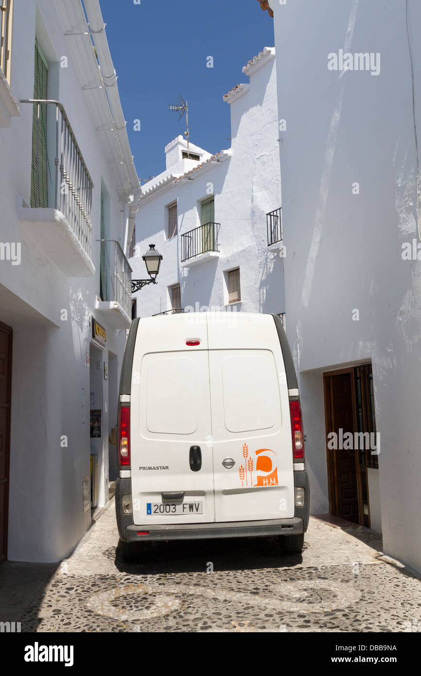 Delivery van in a very narrow street in one of the many Spanish white ...