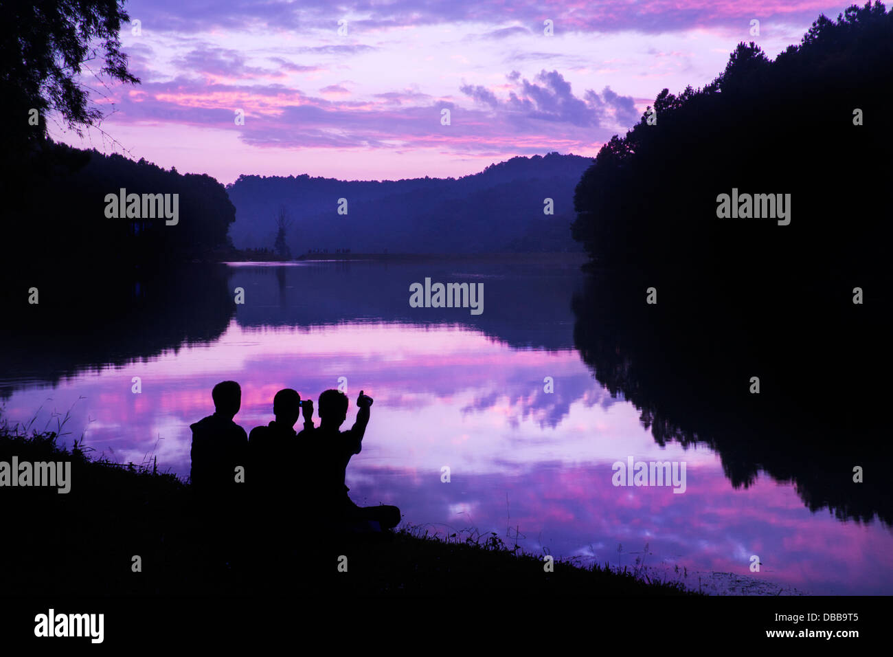 Friend-Family sitting to see beautiful landscape Stock Photo - Alamy