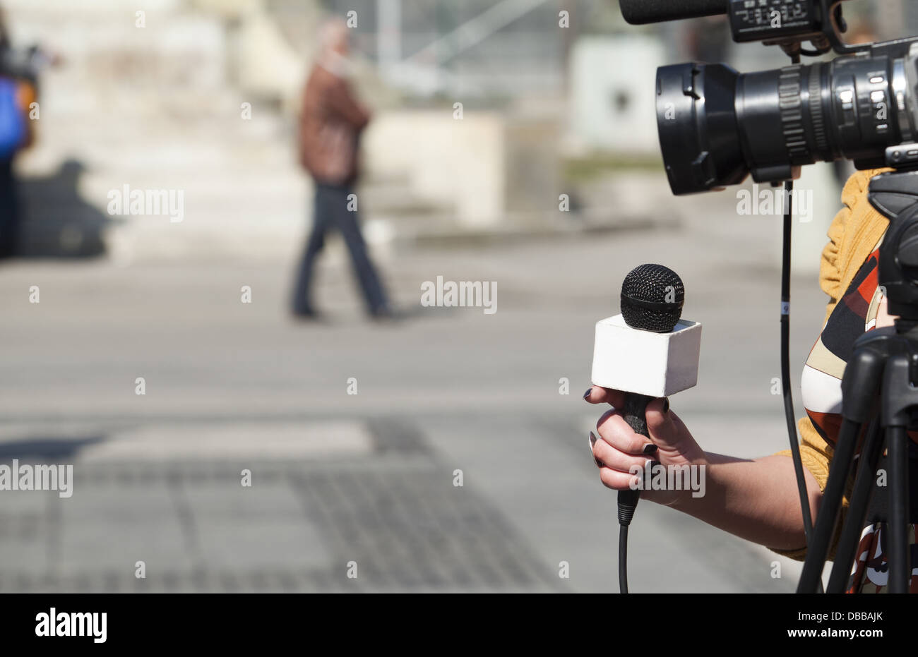 journalist hand holding a microphone conducting an TV or radio ...