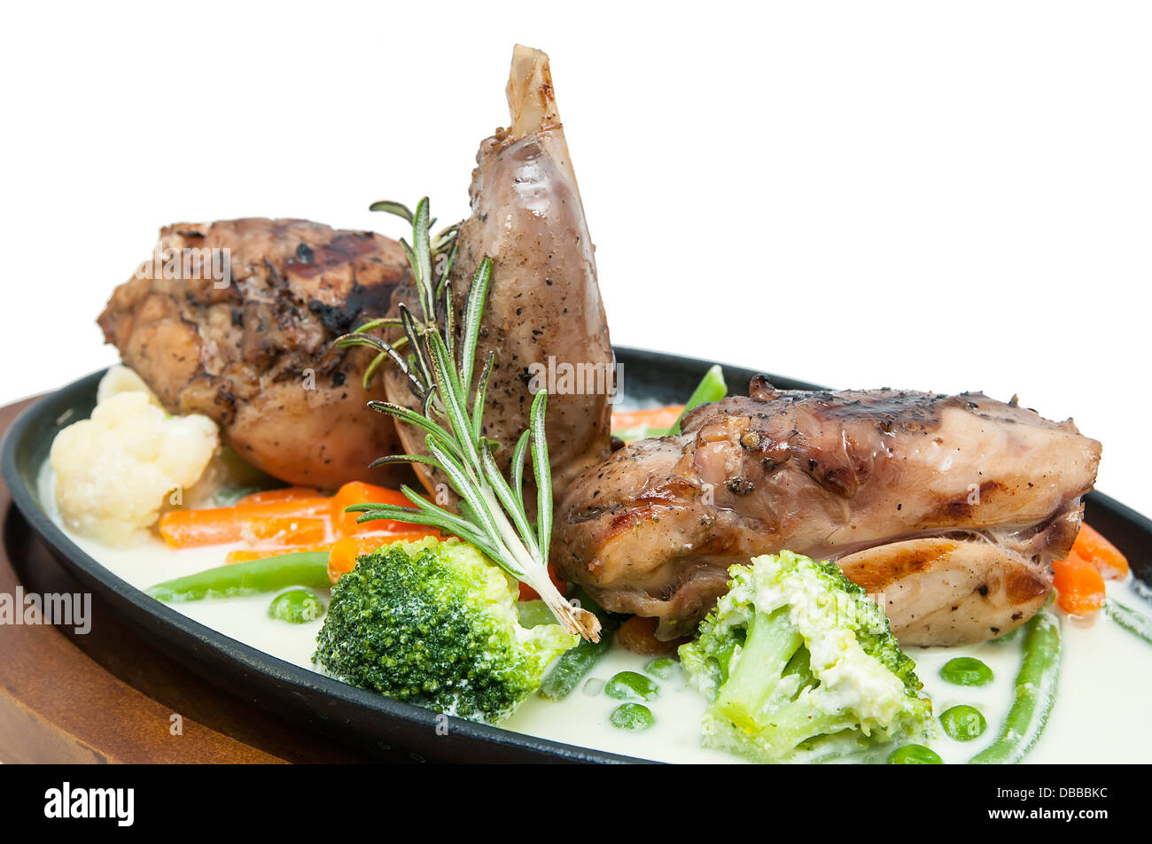 roasted rabbit meat and potatoes with vegetables Stock Photo - Alamy