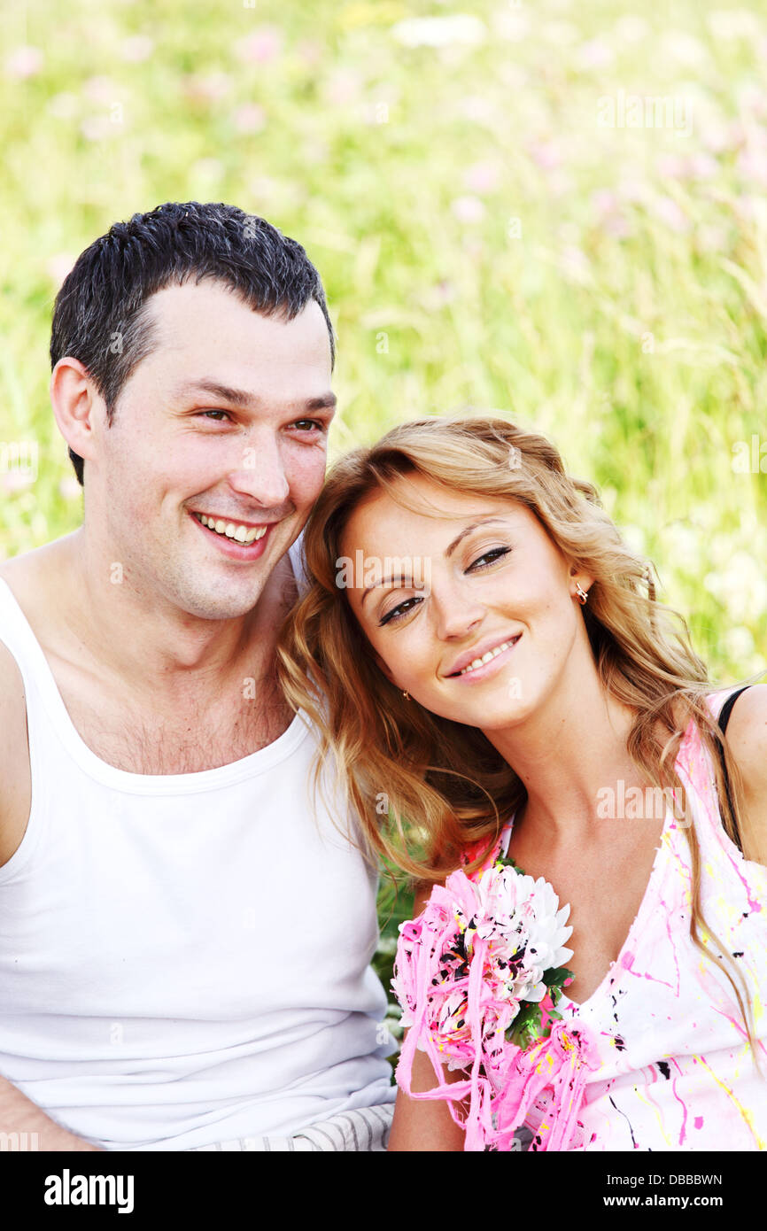 two lovers on grass field Stock Photo - Alamy