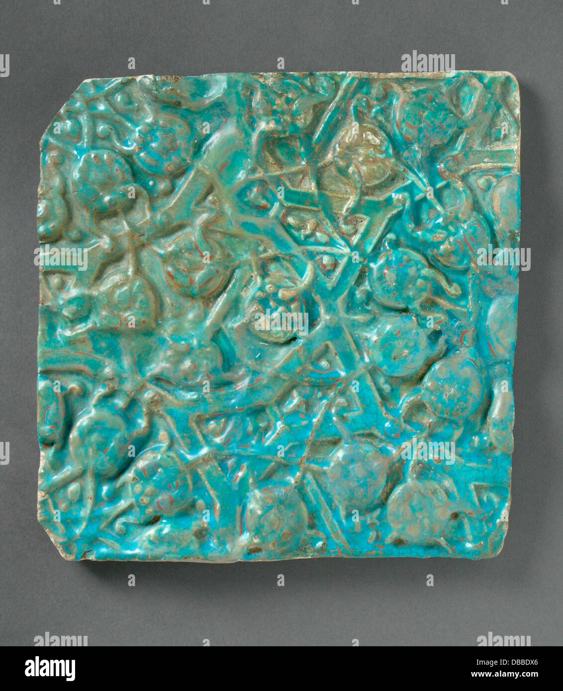 This ceramic tile, made using traditional casting techniques, features ...