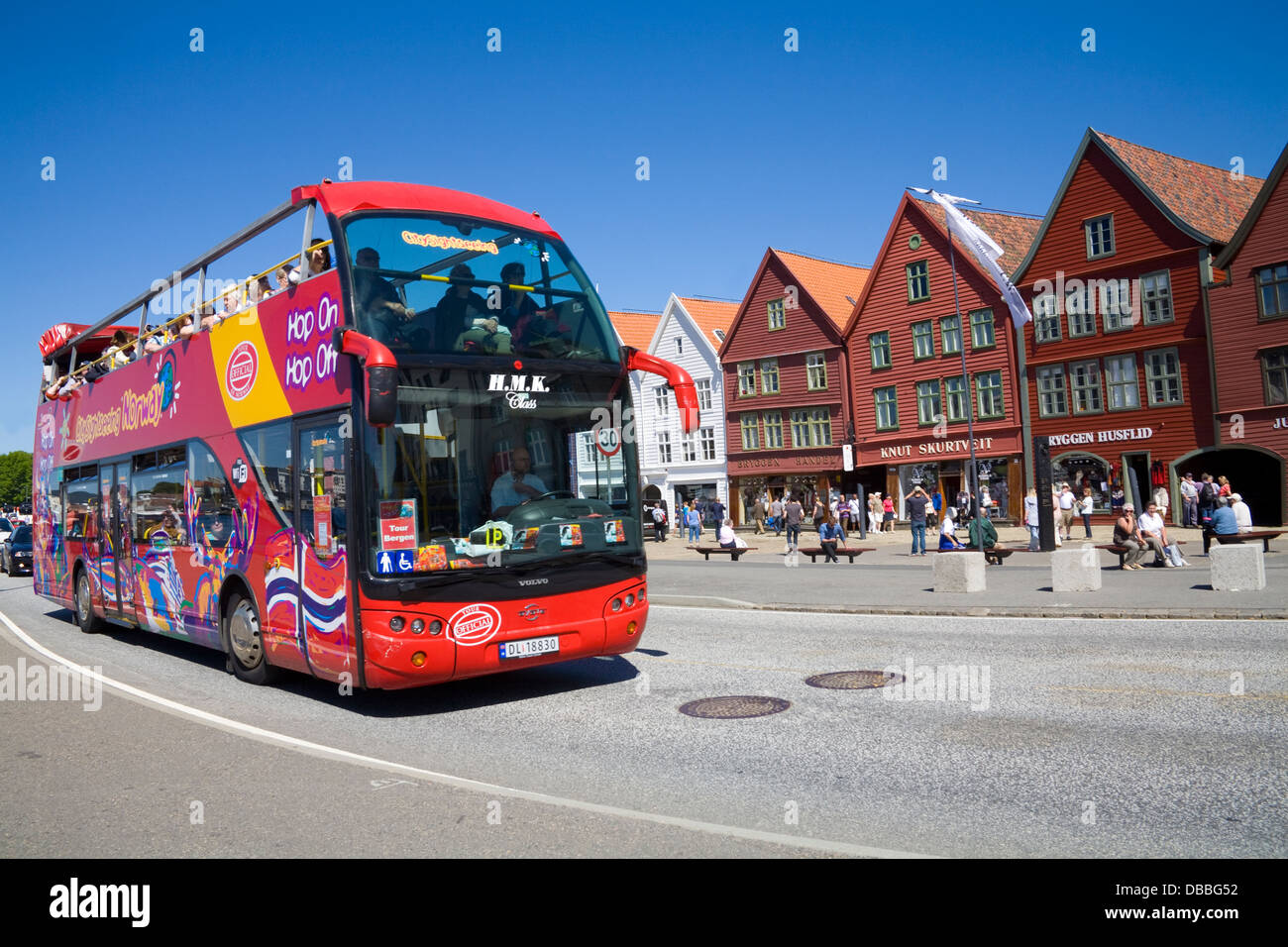 Bergen Norway Europe Open top sightseeing bus passing Bryggen Hanseatic ...