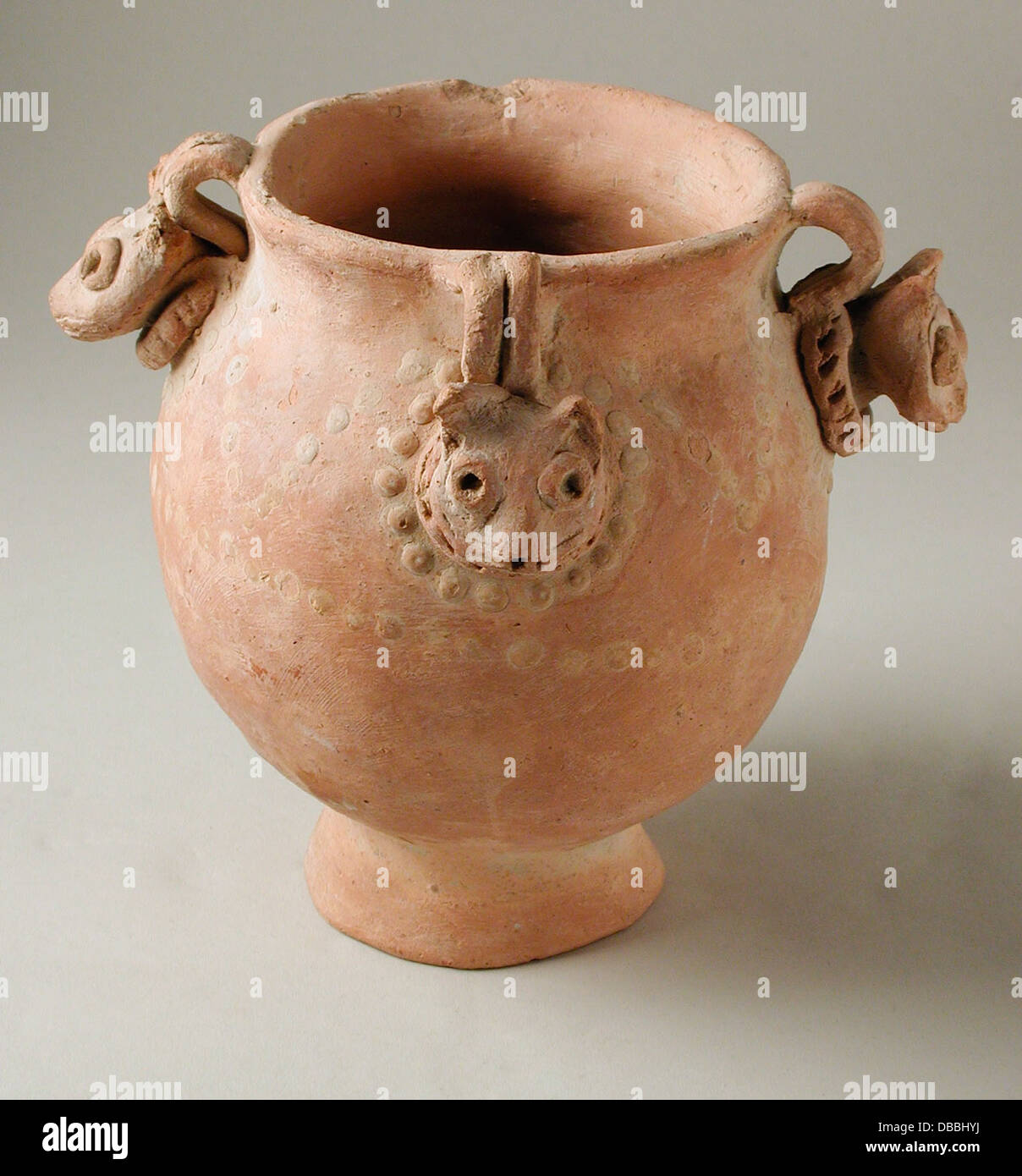 This vase, crafted from ceramic, exemplifies ancient pottery techniques ...