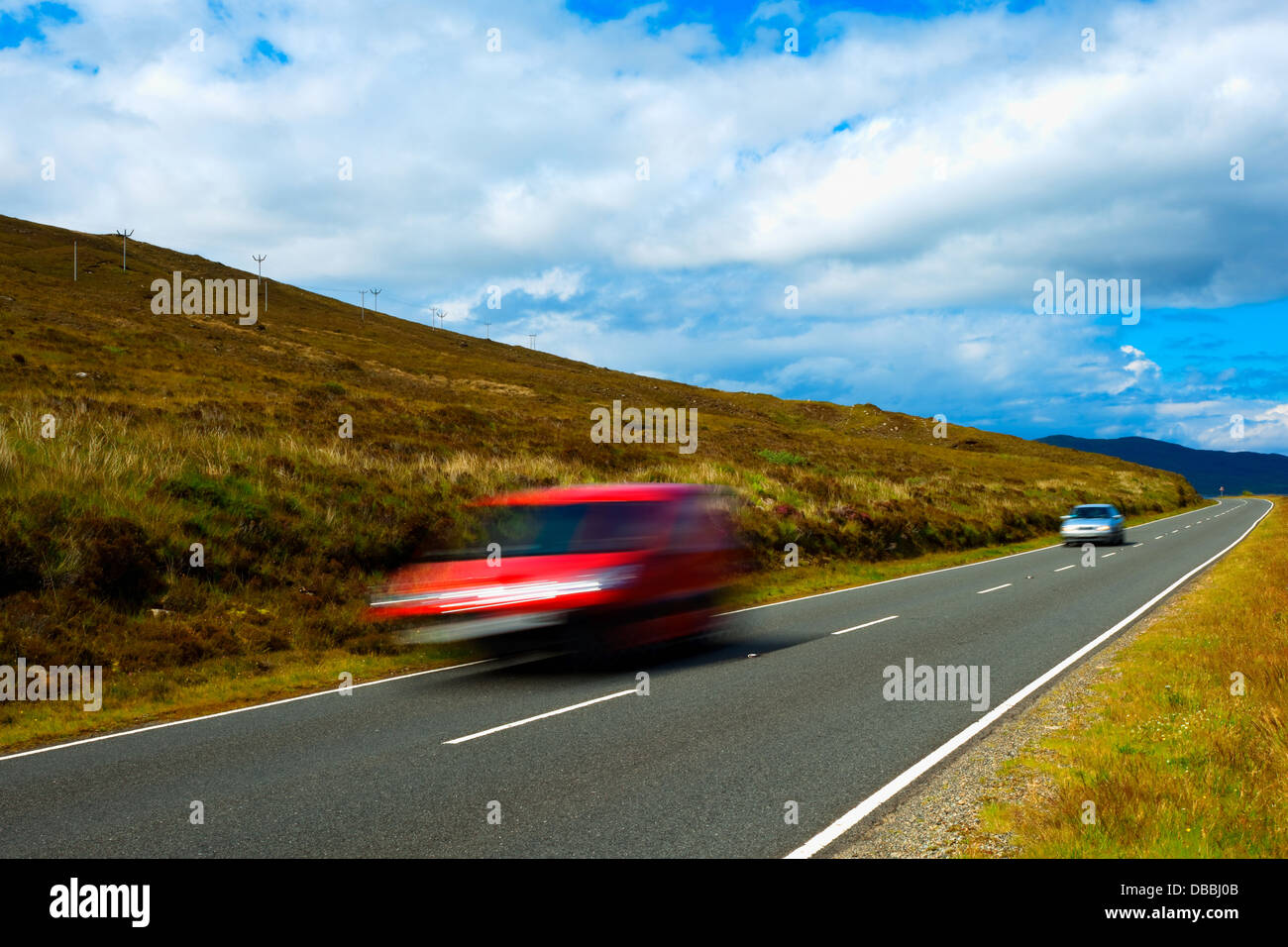 Cars Speeding on Country Road Stock Photo - Alamy