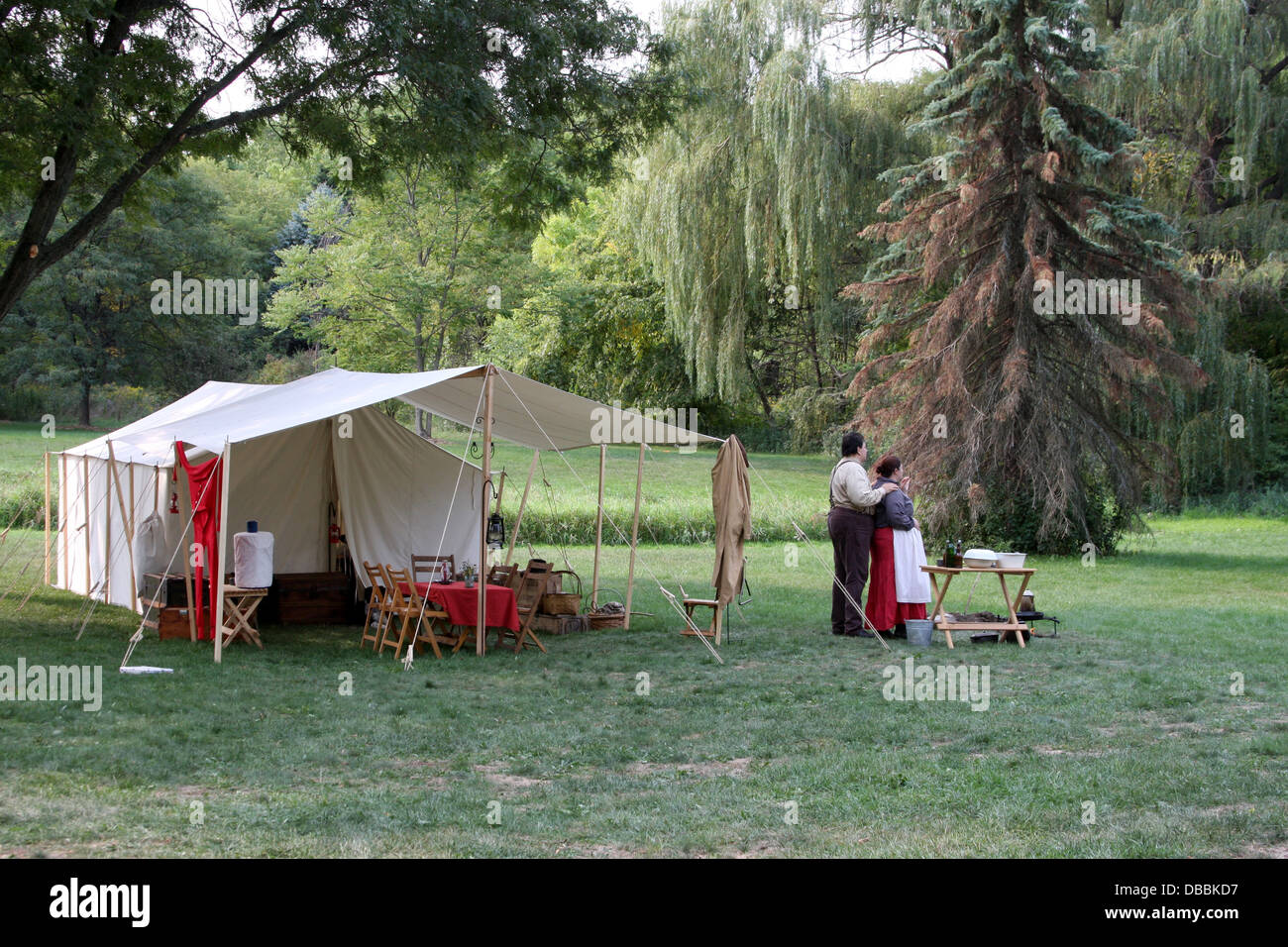 A couple camping with their western tent reenactment Stock Photo - Alamy