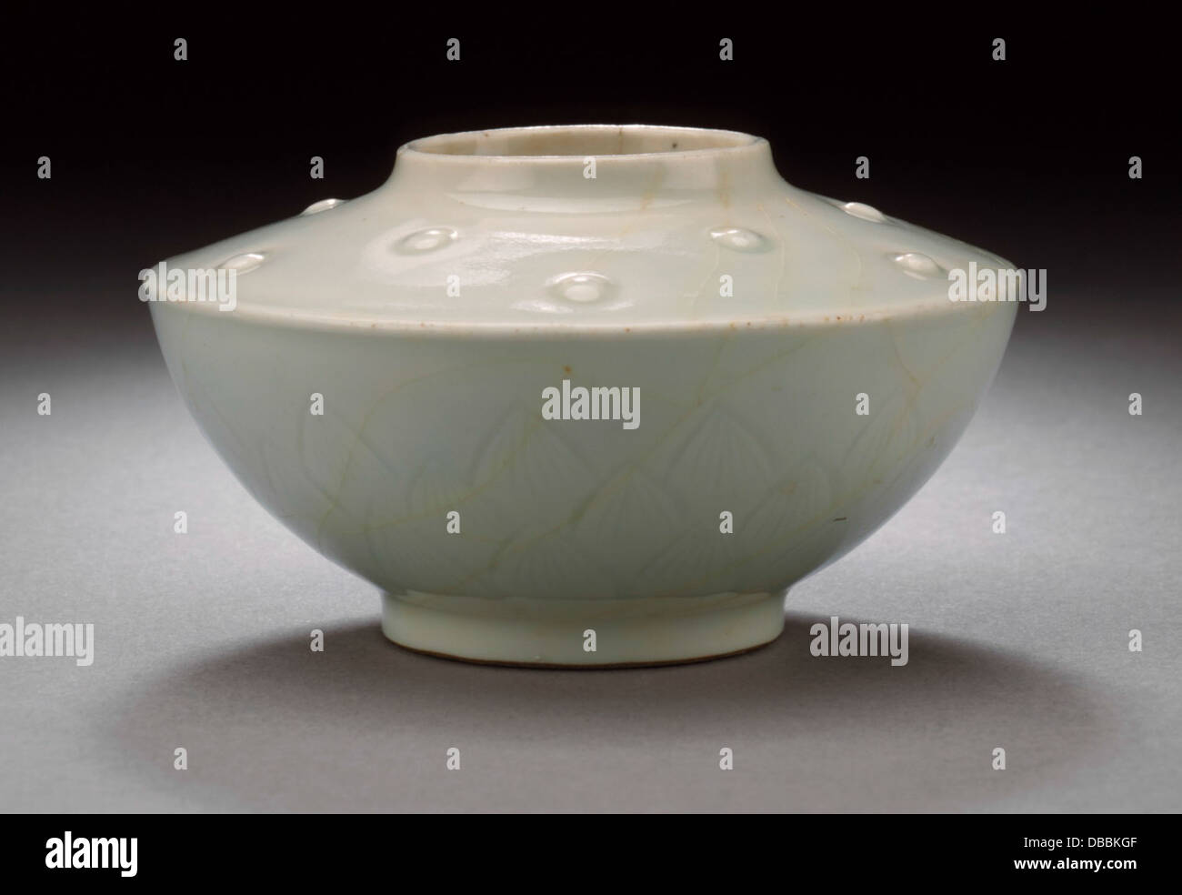 This water pot, shaped like a lotus pod, is a fine example of ancient ...
