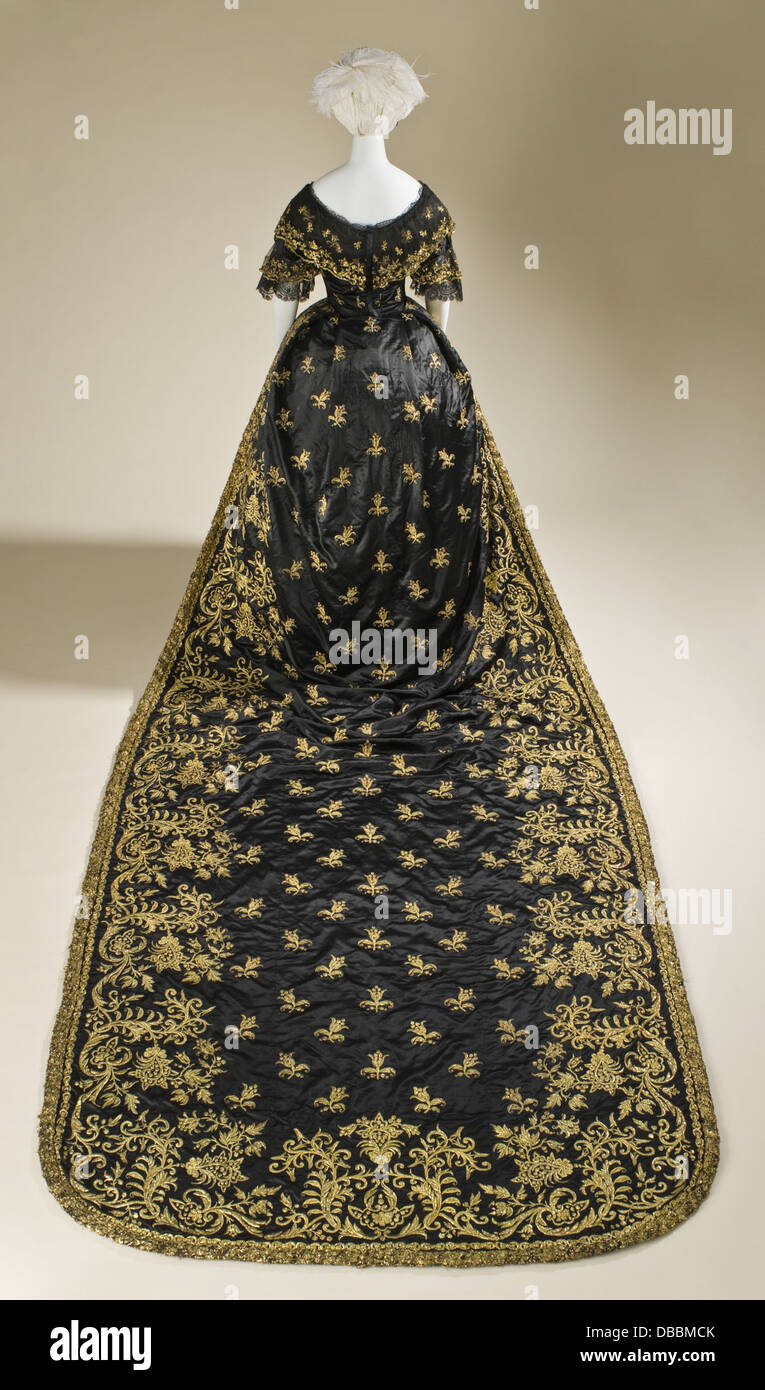 This woman’s dress ensemble is a complete set of garments, showcasing ...