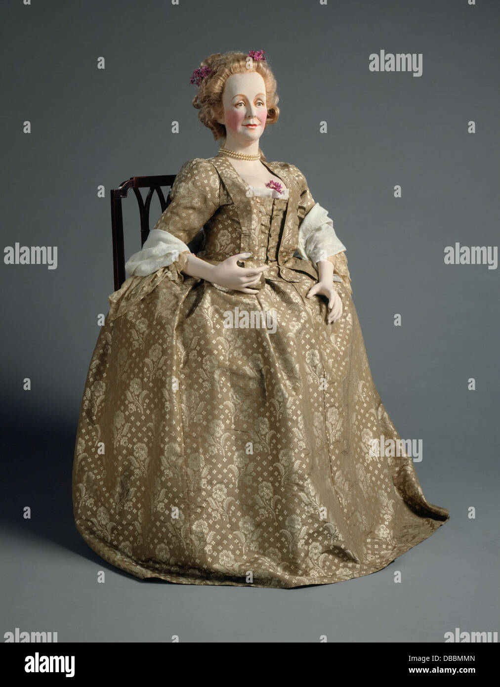 This woman's dress is a historical garment, showcasing textile ...