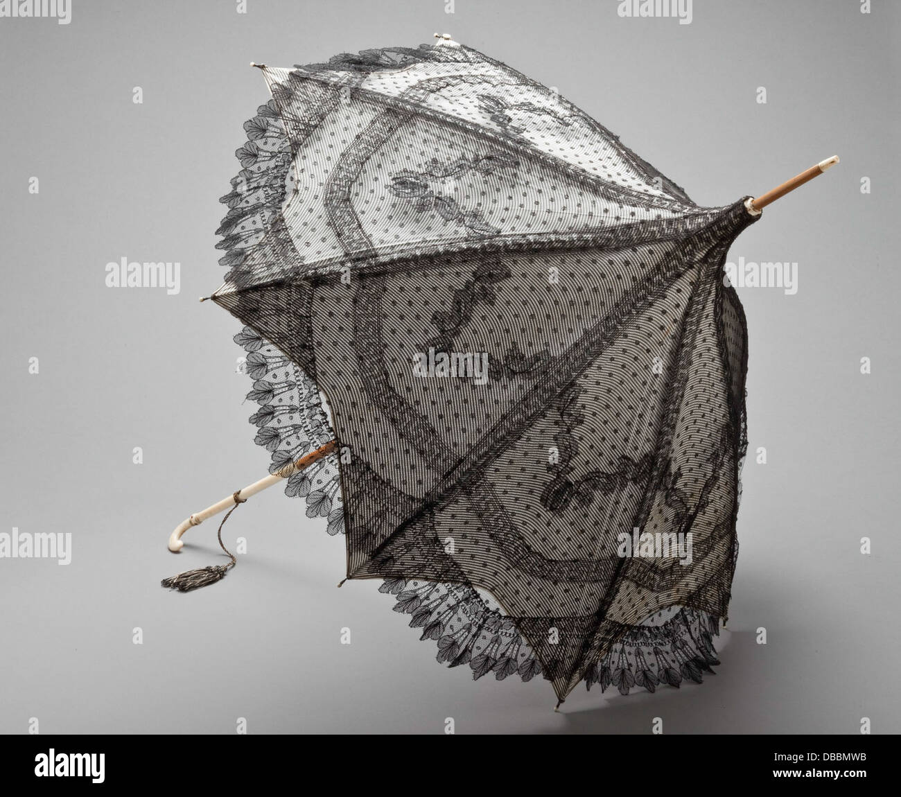 This woman’s parasol from the 19th century features an intricate design ...