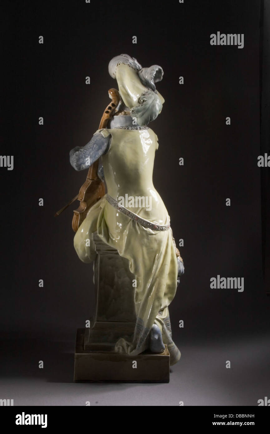 This artwork features a woman playing a 'viola da gamba', a stringed ...