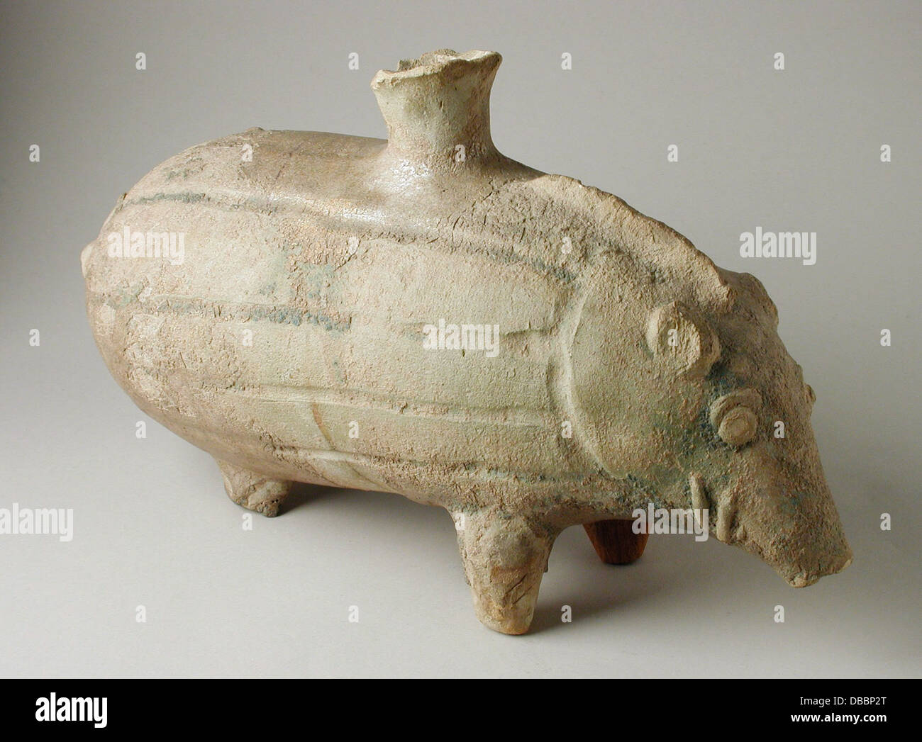 This zoomorphic vessel, crafted from cast bronze, represents an ancient artifact with a symbolic ...