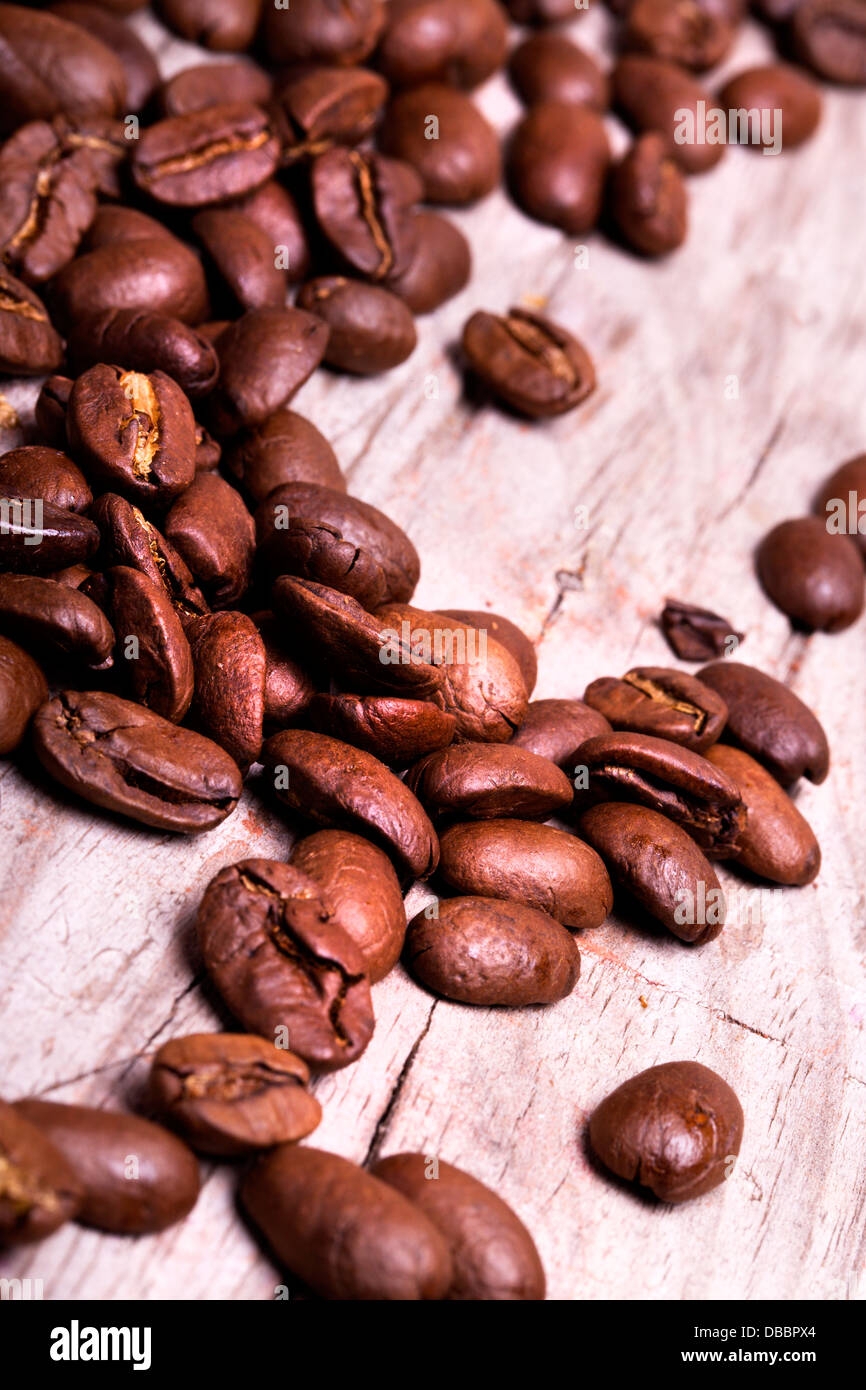 Closeup of coffee beans. Coffee bean on macro ground coffee background ...