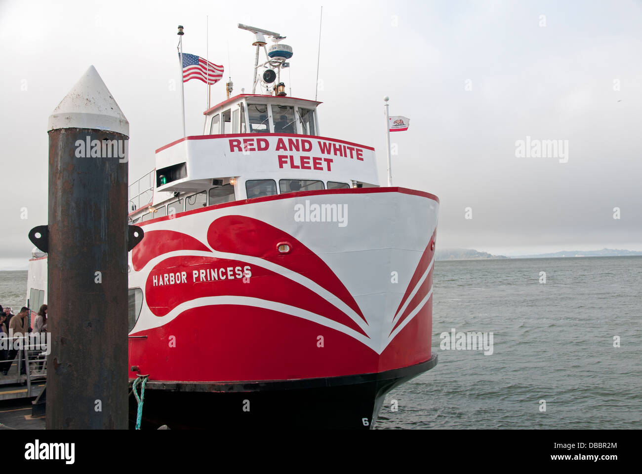 Red and White tour boat docked at pier in San Francisco, California ...
