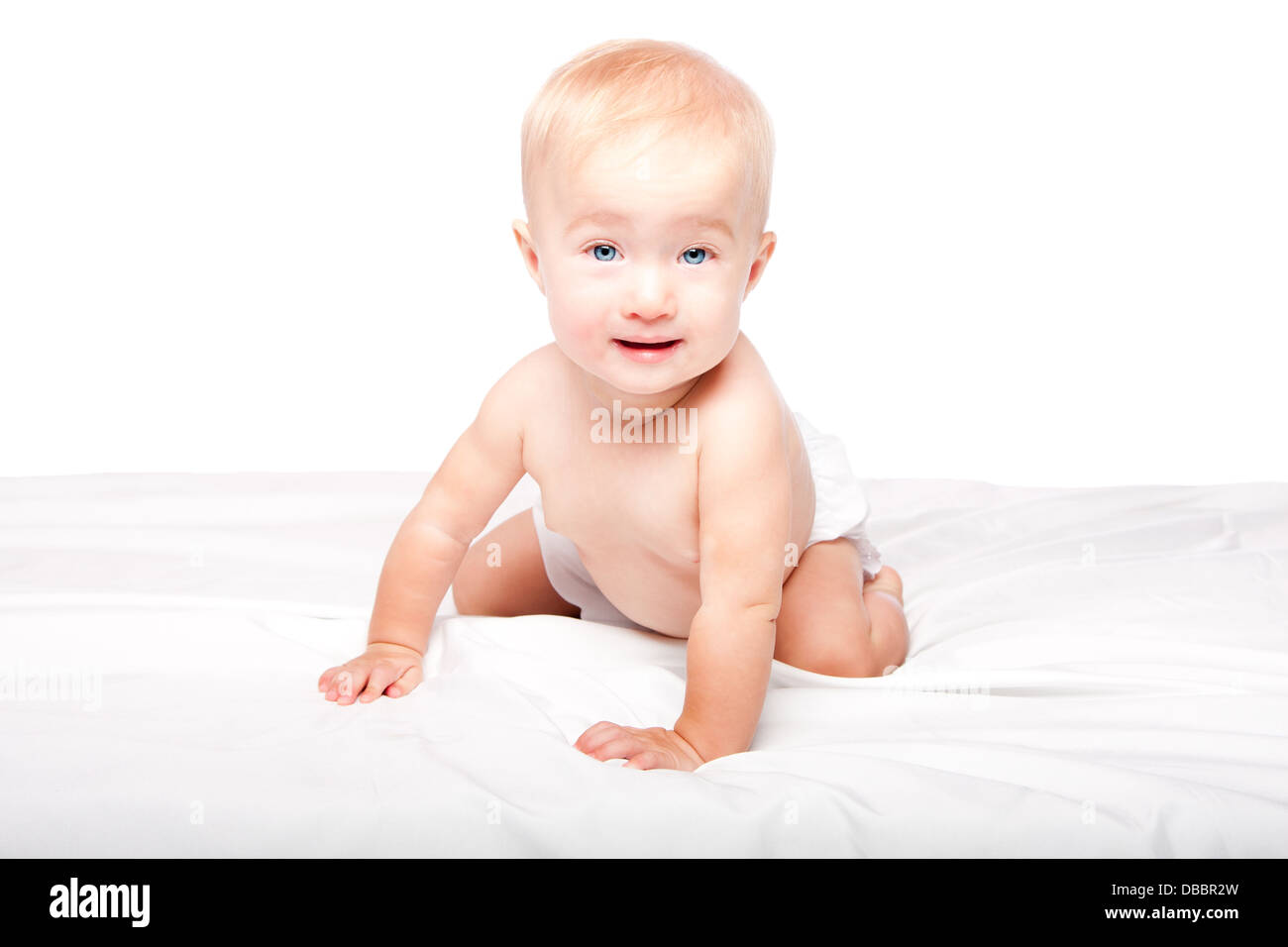 Cute adorable happy crawling baby infant with blue eyes in diapers, on ...
