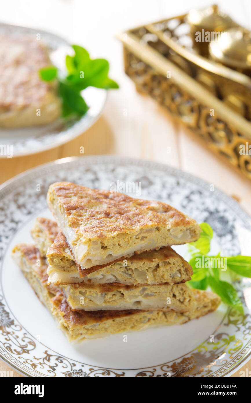 Mutabbaq or Murtabak is a stuffed Arabic bread, also known as "Fatatari ...