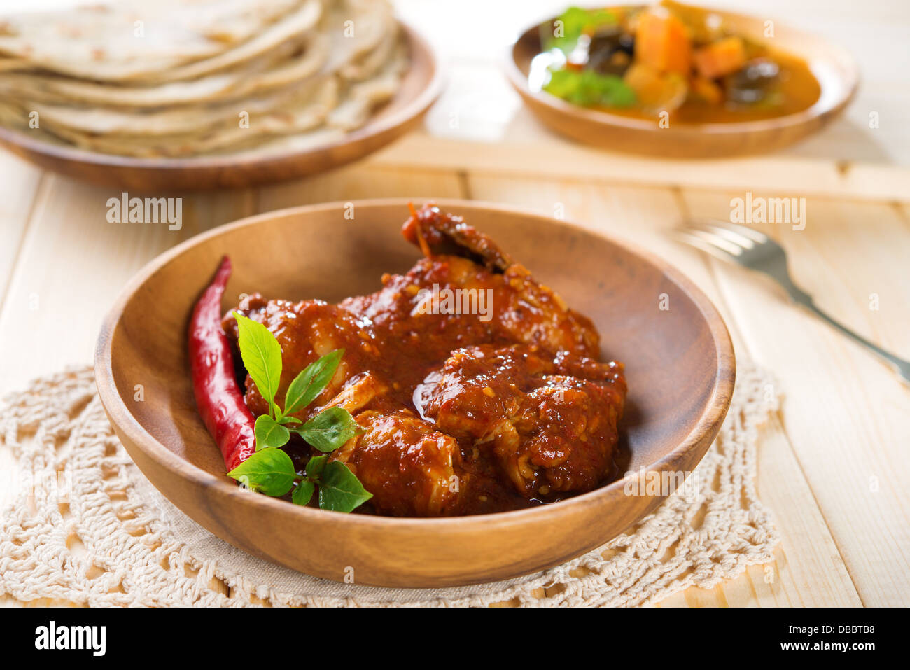 Indian curry chicken. Popular Indian dish on dining table Stock Photo ...