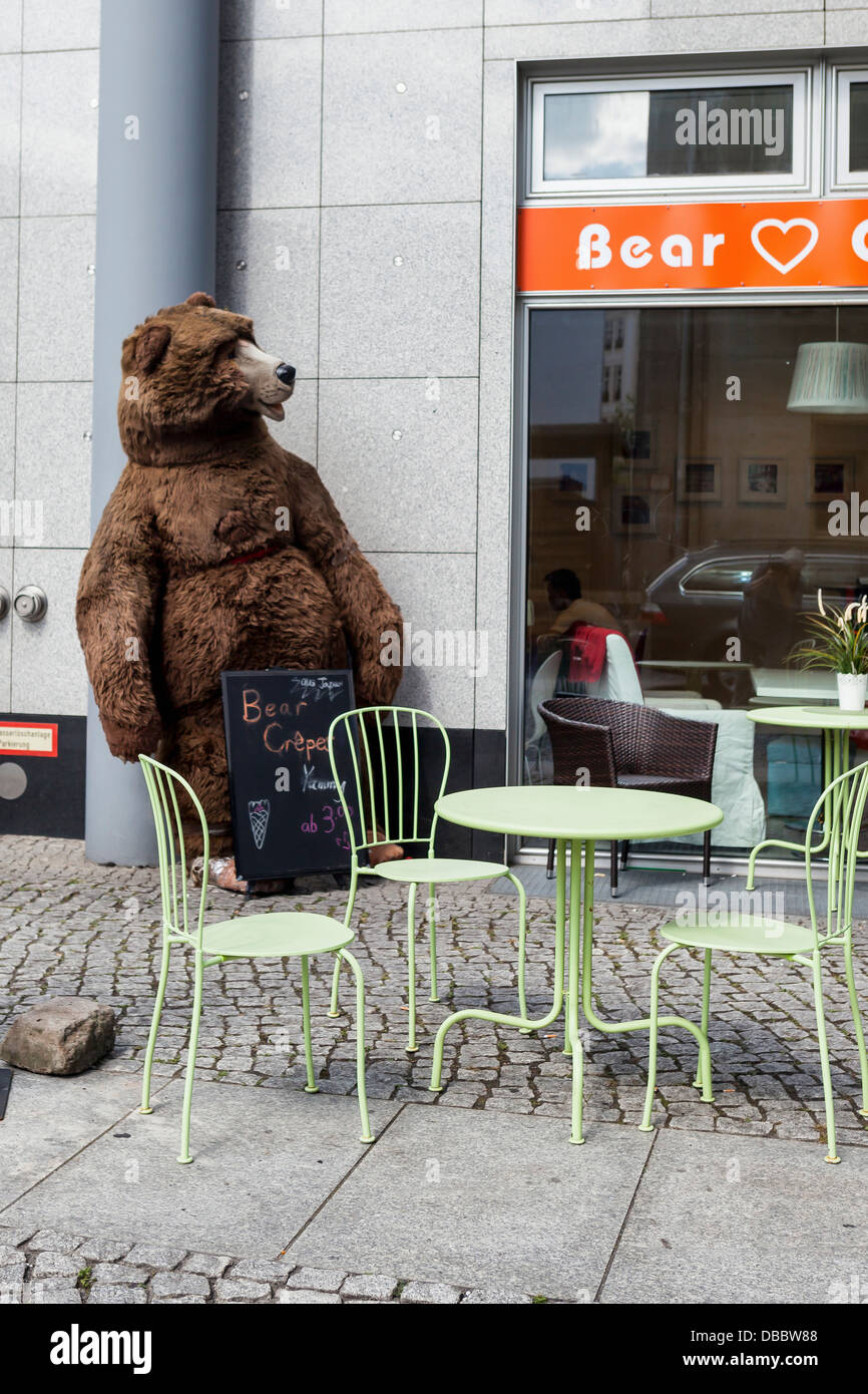 Symbol of Berlin - the bear in front of arestaurant Stock Photo - Alamy