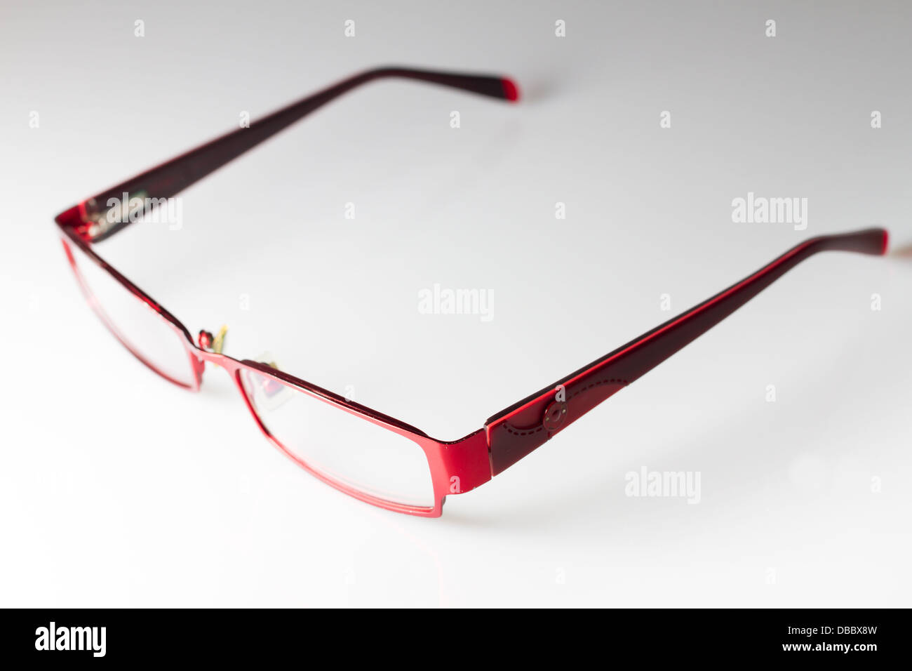 Red spectacles on isolated white background Stock Photo - Alamy