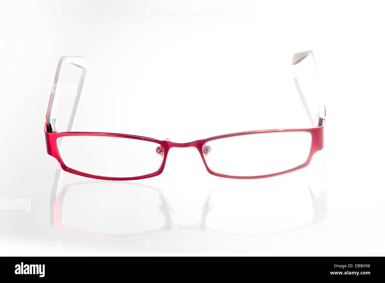 Red spectacles on isolated white background Stock Photo - Alamy