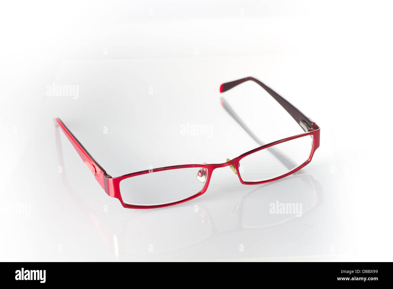 Red spectacles on isolated white background Stock Photo - Alamy