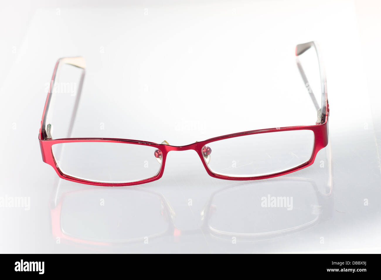 Red spectacles on isolated white background Stock Photo - Alamy