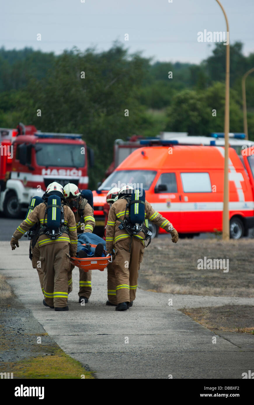 Firefighters rescue injured man Stock Photo - Alamy