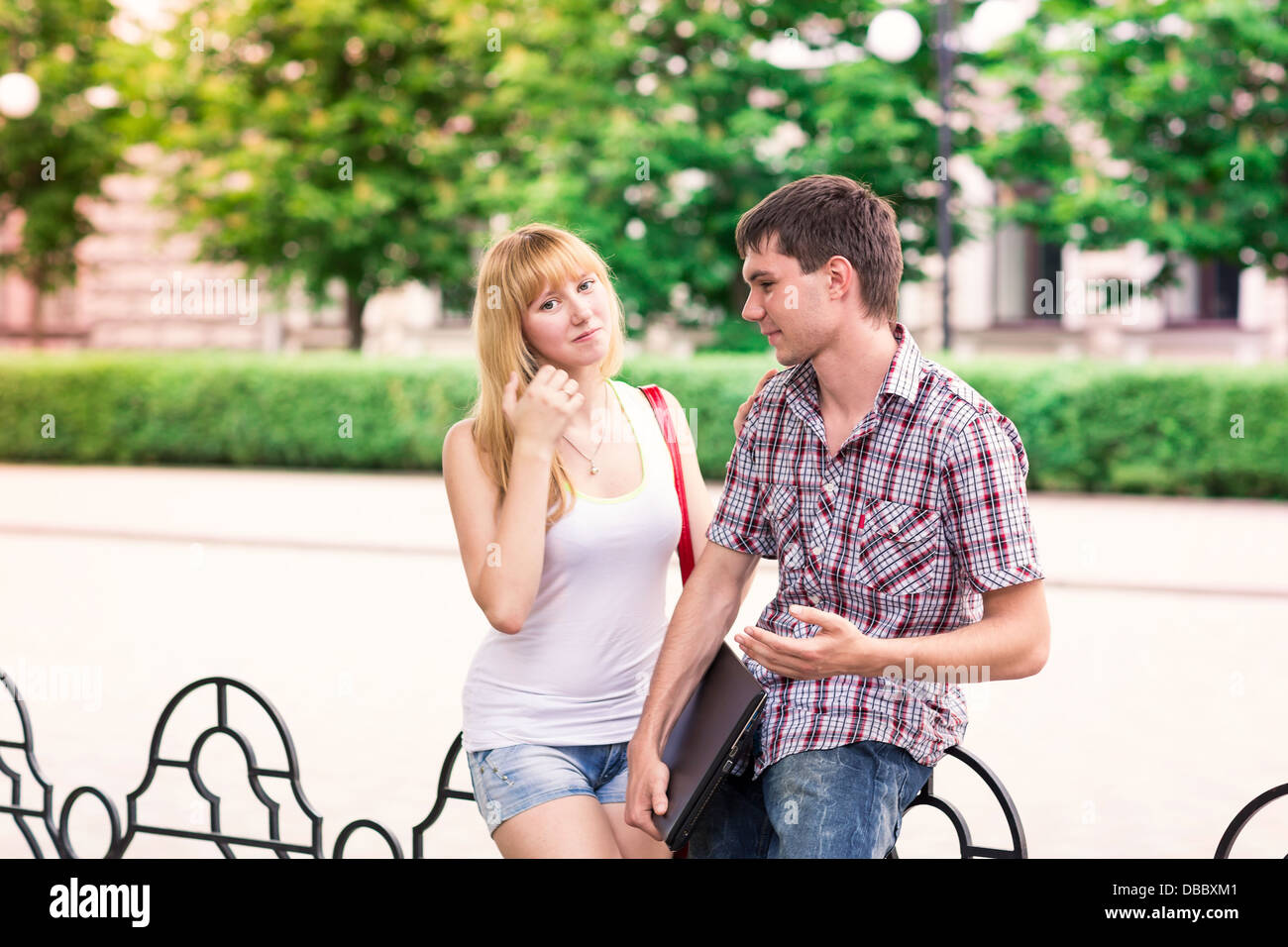 A couple of happy smiling Teenage Students talking outdoor Stock Photo ...