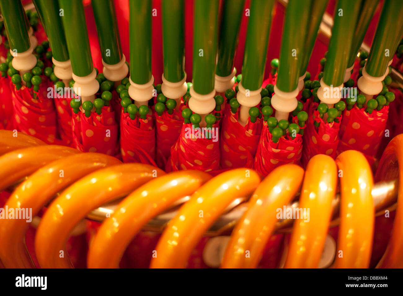 A rack of colourful red umbrellas Stock Photo - Alamy