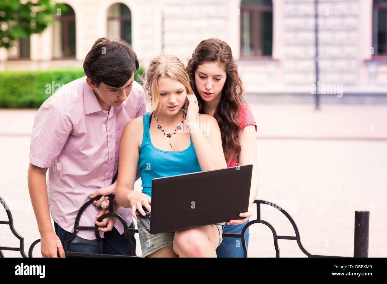 Group of happy smiling Teenage Students looking in laptop Stock Photo ...