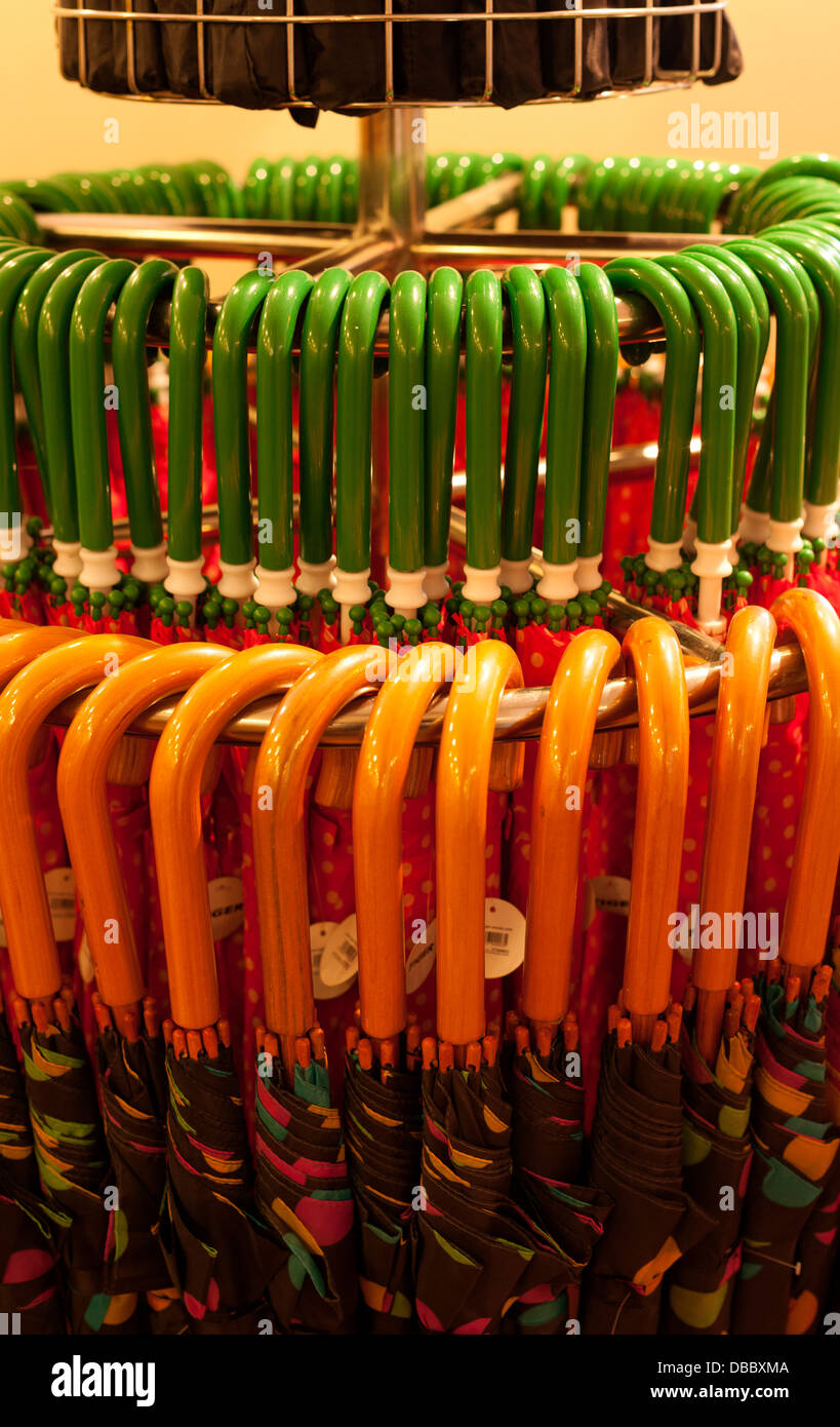 A rack of colourful red umbrellas Stock Photo - Alamy