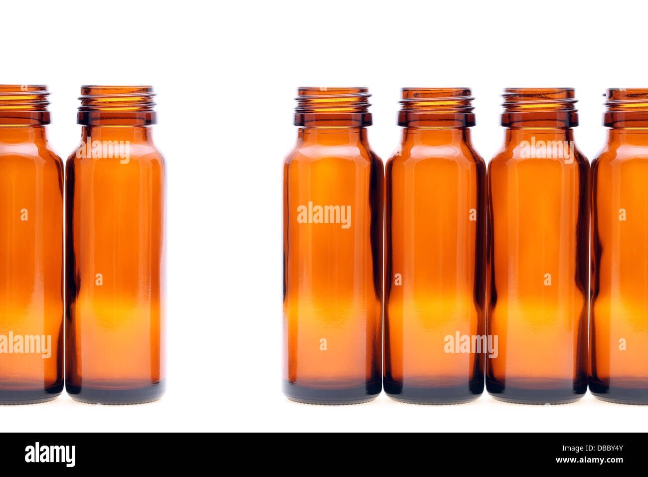 Brown glass bottles on white background Stock Photo - Alamy