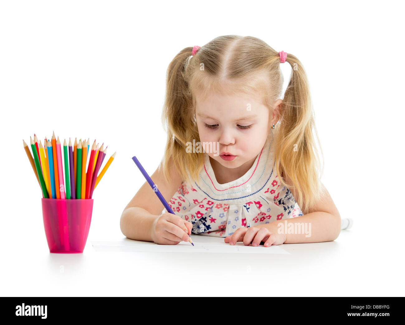 Cute kid drawing with color pencils Stock Photo - Alamy