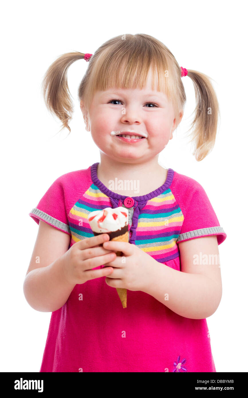 happy kid girl eating ice cream in studio isolated Stock Photo - Alamy