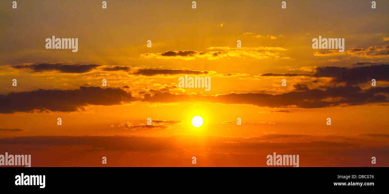 The Sun Shining Over Low Cloud Stock Photo - Alamy