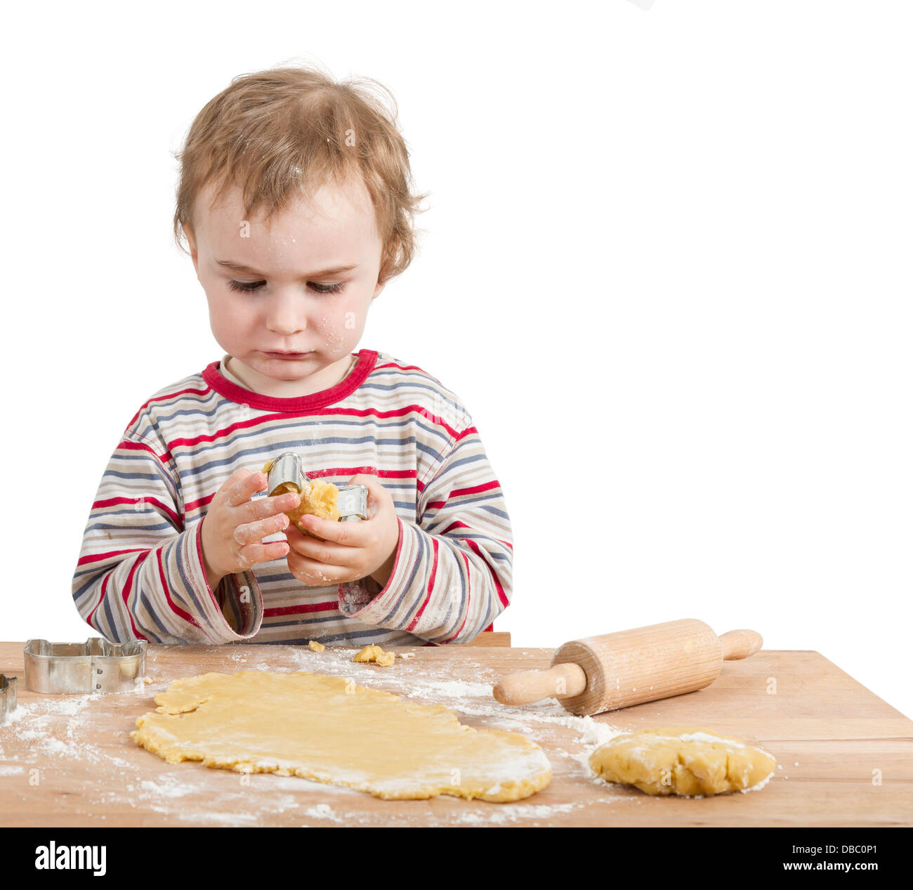 young child with rolling pin and dough. Isolated on white background ...