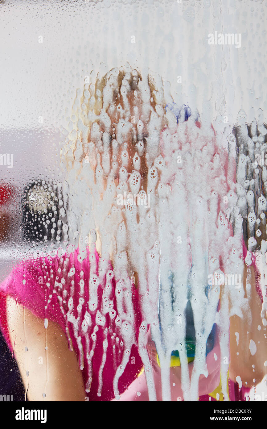 Woman washing the window glass Stock Photo - Alamy