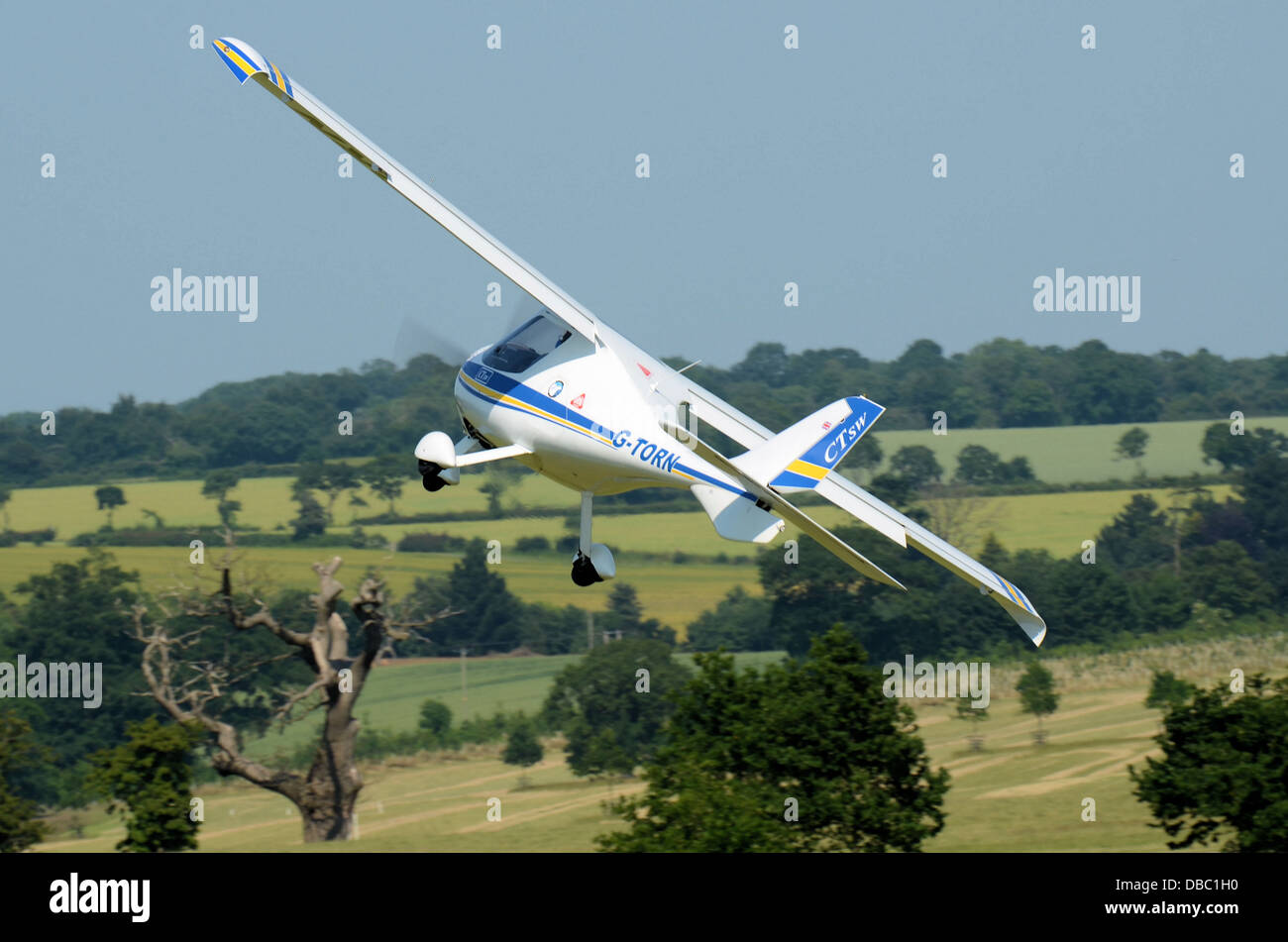 A Flight Design CTSW microlight flying over the Suffolk countryside ...