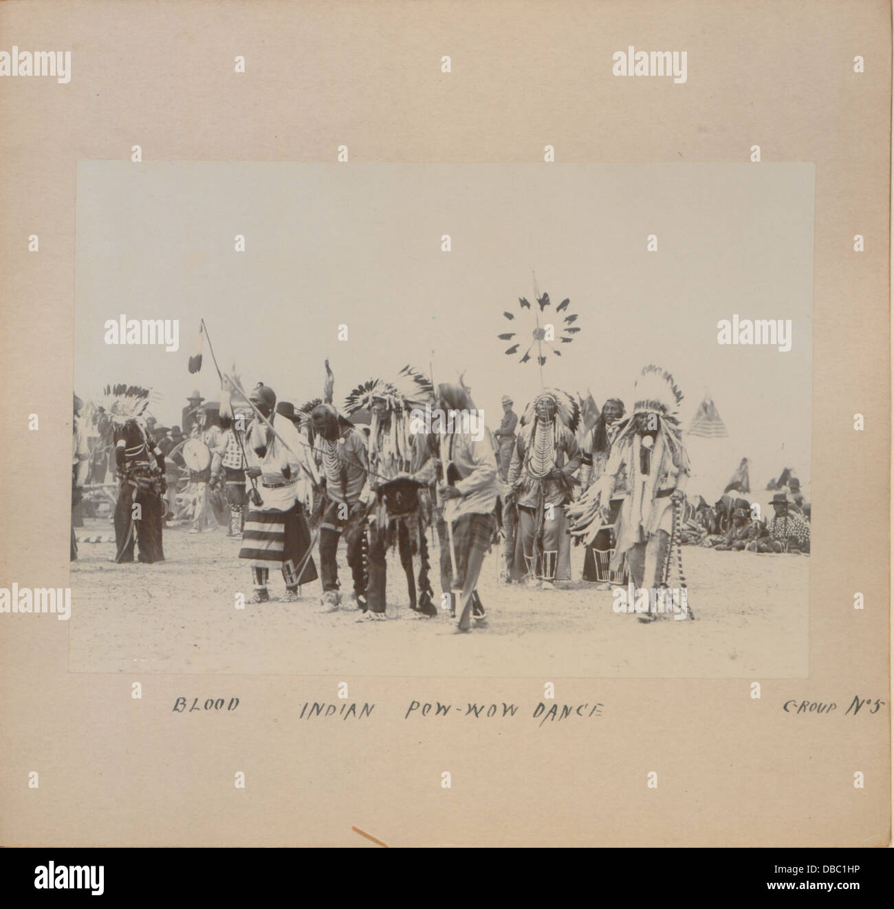 This photograph shows a group of Blood Indians during a pow-wow, a ...